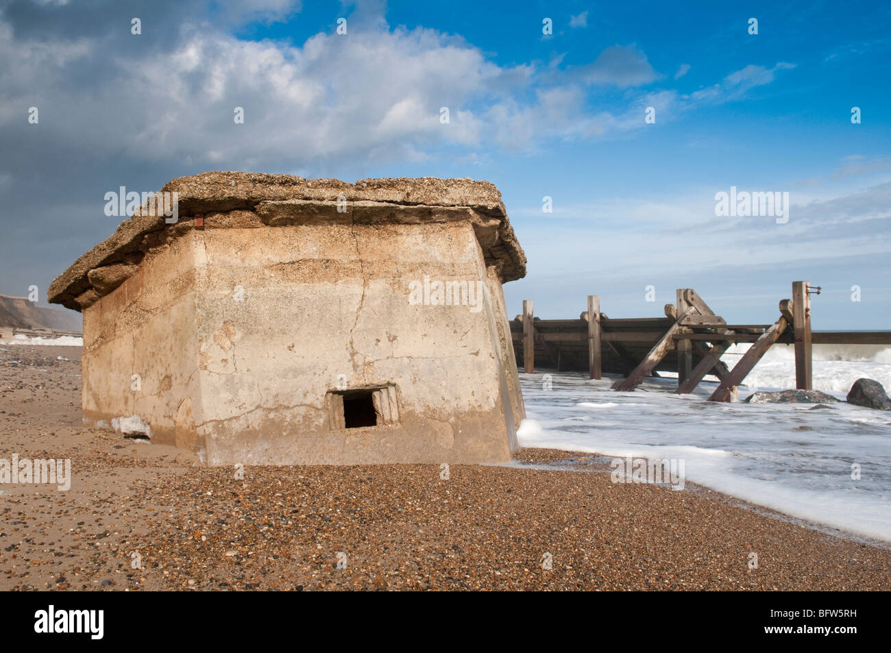 Overturned World War Two pill box on the beach at Happisburgh, Norfolk ...