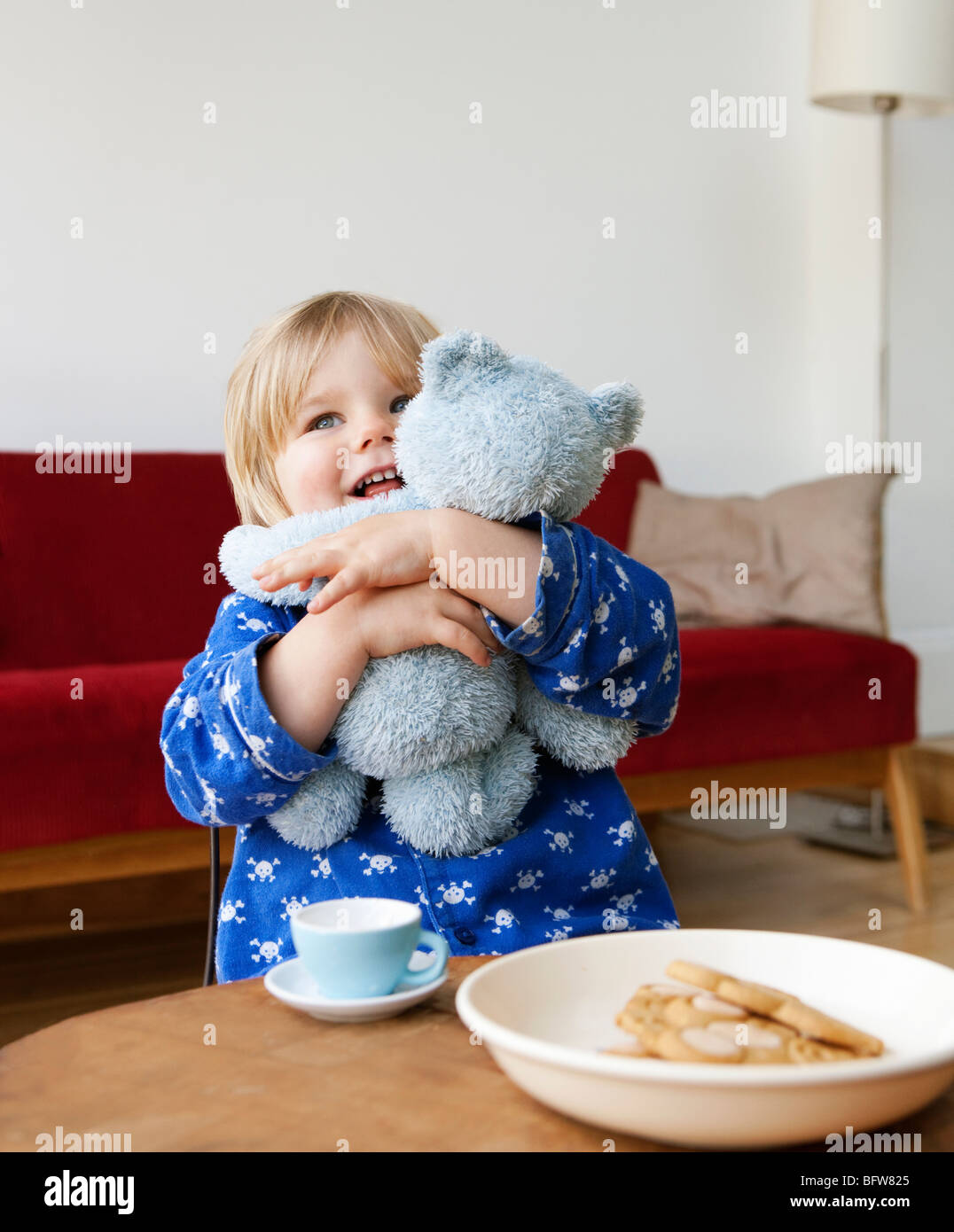 A boy toddler cuddling his teddy bear Stock Photo - Alamy