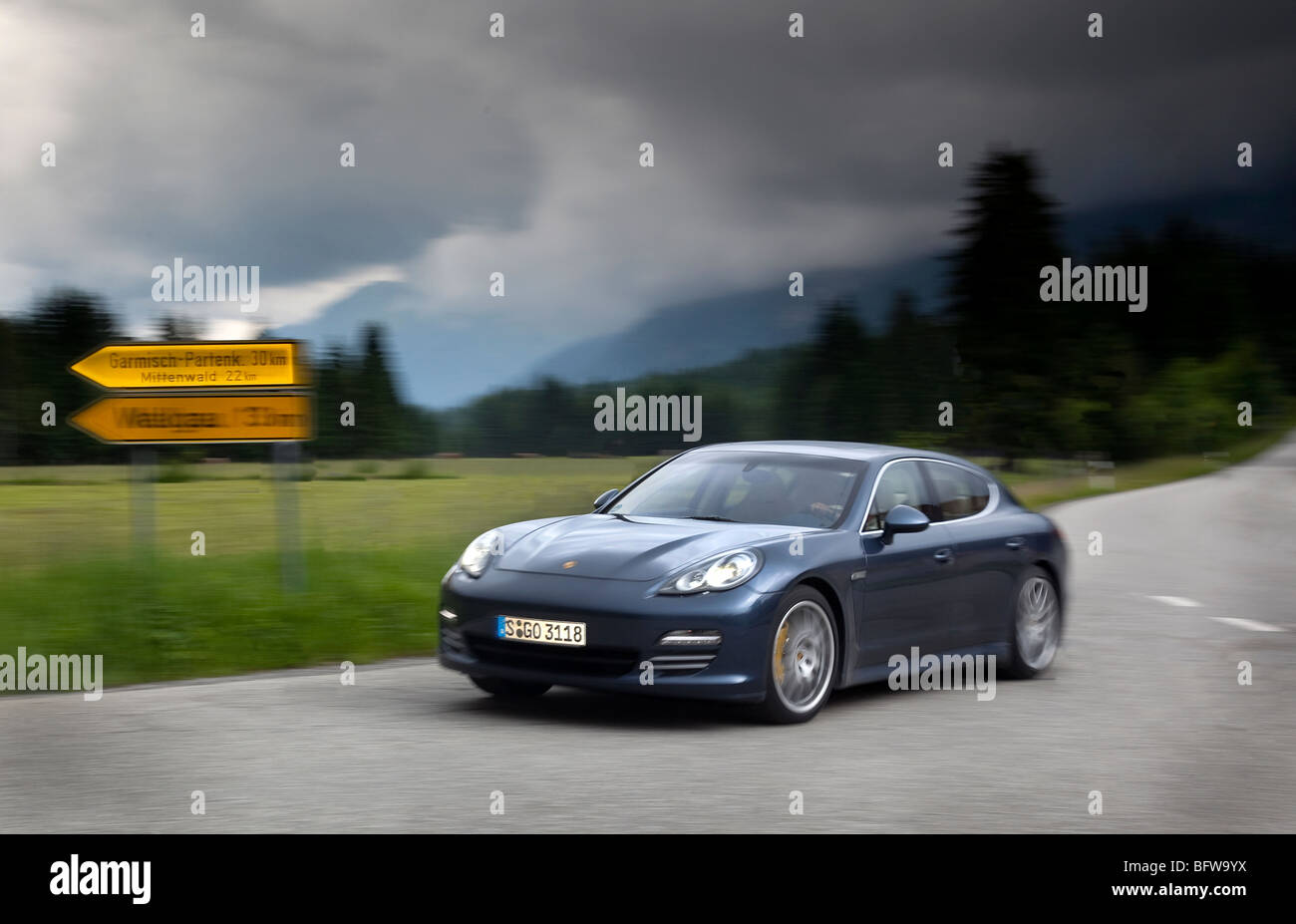 Porsche Panamera sports saloon car driving on the road in Germany Stock ...