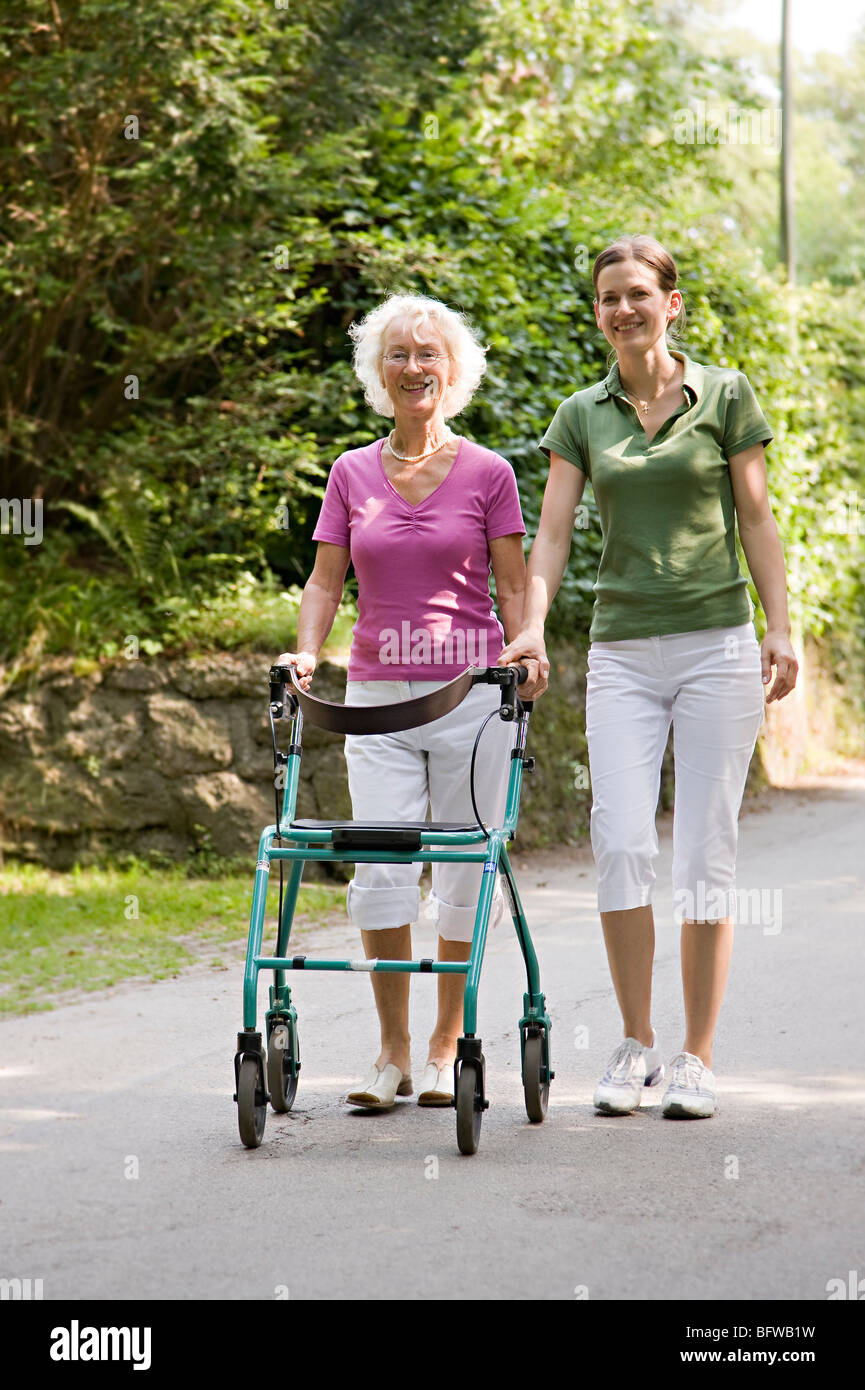 Senior woman walking in park hi-res stock photography and images - Alamy
