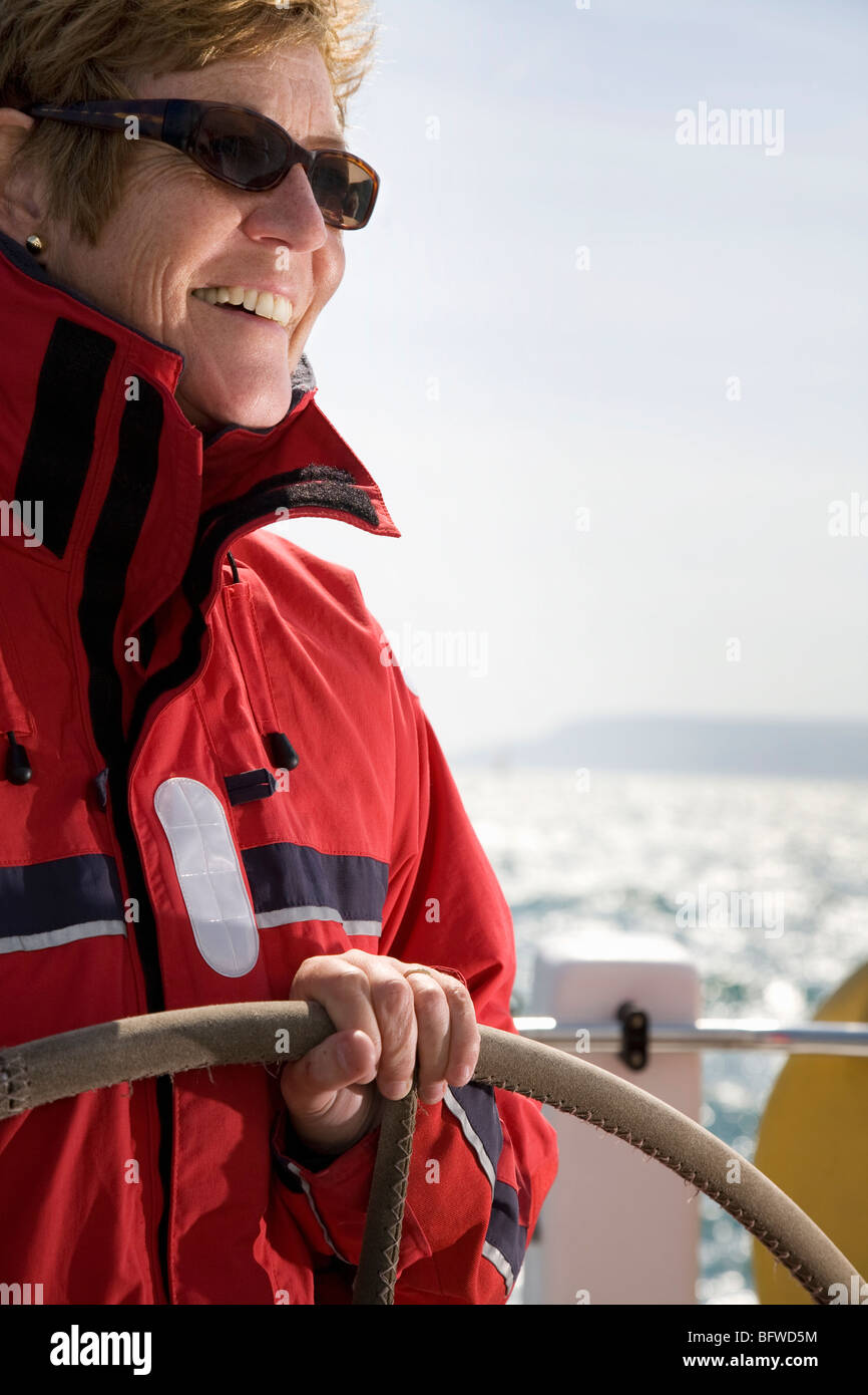 Woman sailing yacht Stock Photo - Alamy