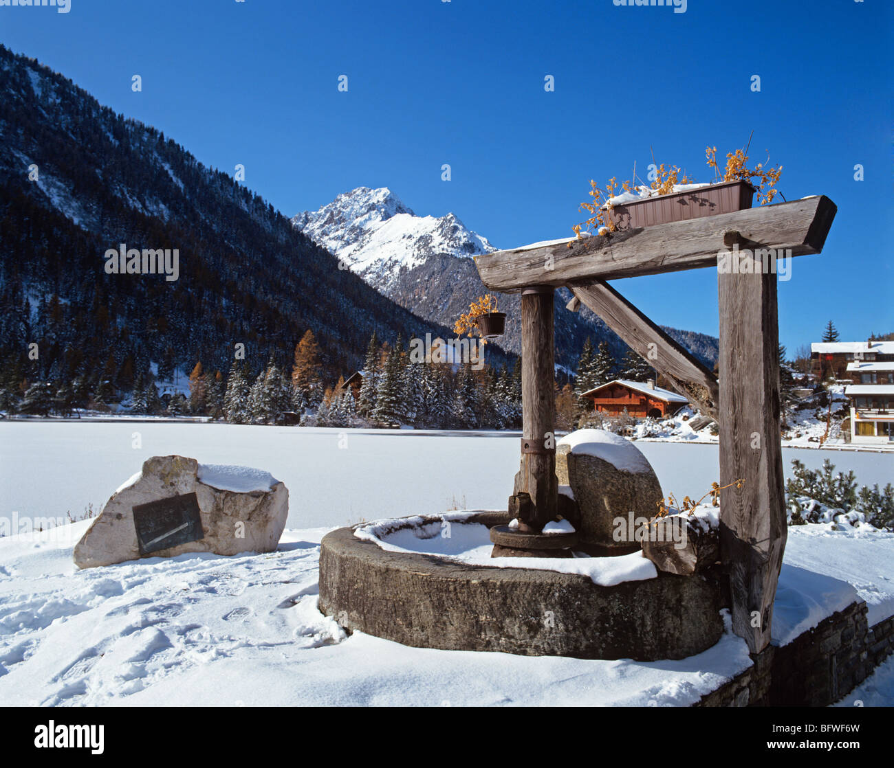 View across the frozen Lac de Champex at the Valais winter resort of ...
