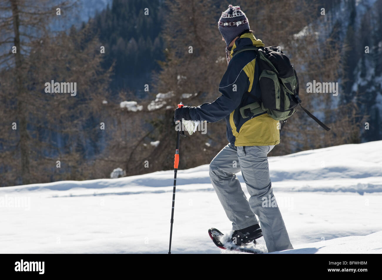 Young man in snow hiking Stock Photo - Alamy