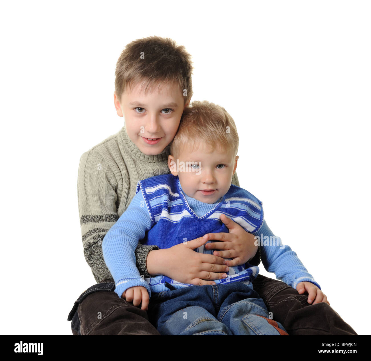 Two brothers. Age of 3 and 7 years. It is isolated on a white ...
