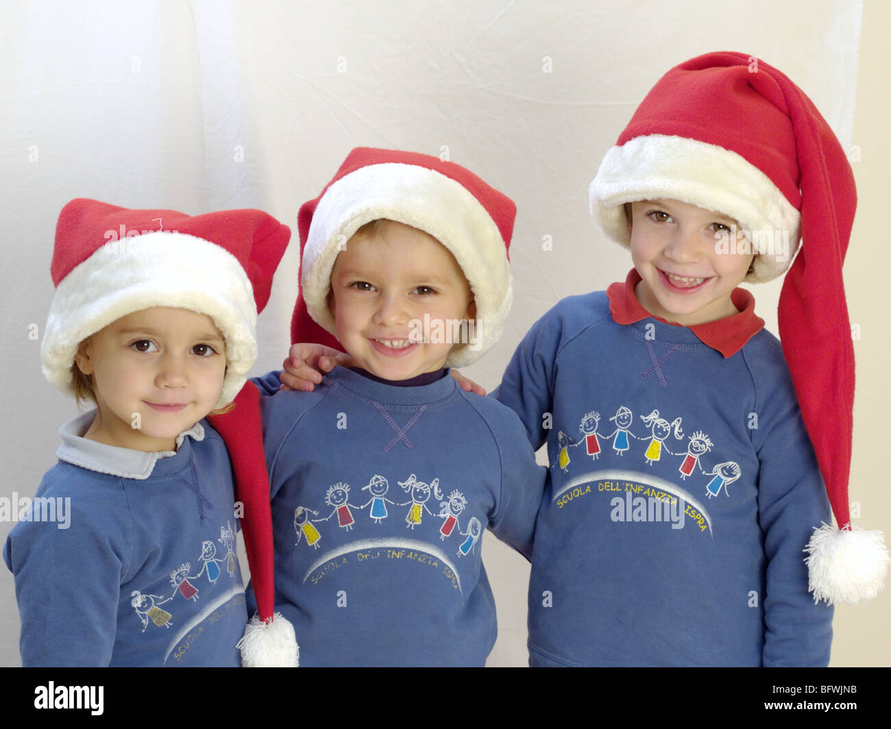Santa claus hats christmas holiday children brothers hi-res stock ...