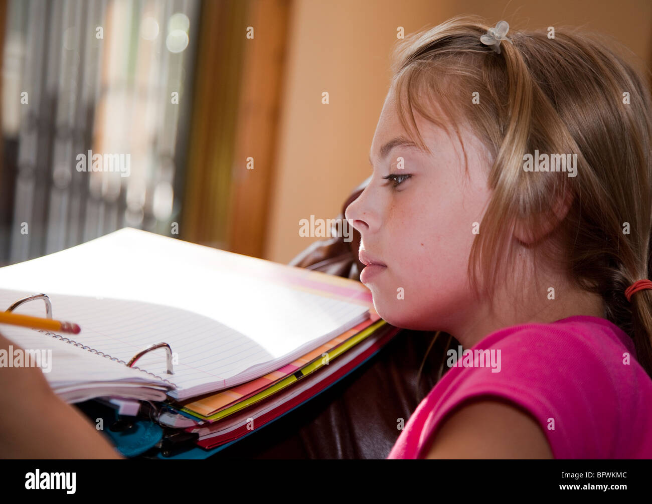 Young girl doing her homework Stock Photo - Alamy