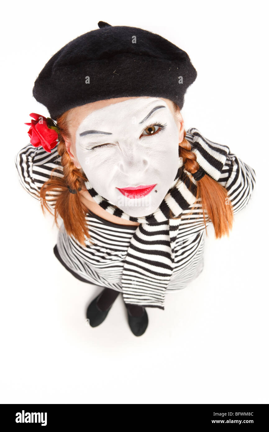Portrait of a young lady dressed up as a mime isolated on white ...