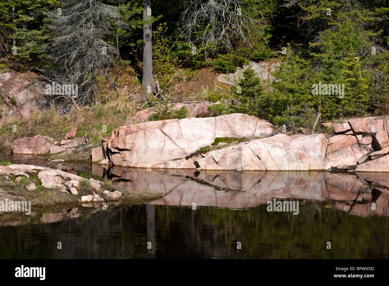 Canadian shield granite outcrops reflected hi-res stock photography and ...