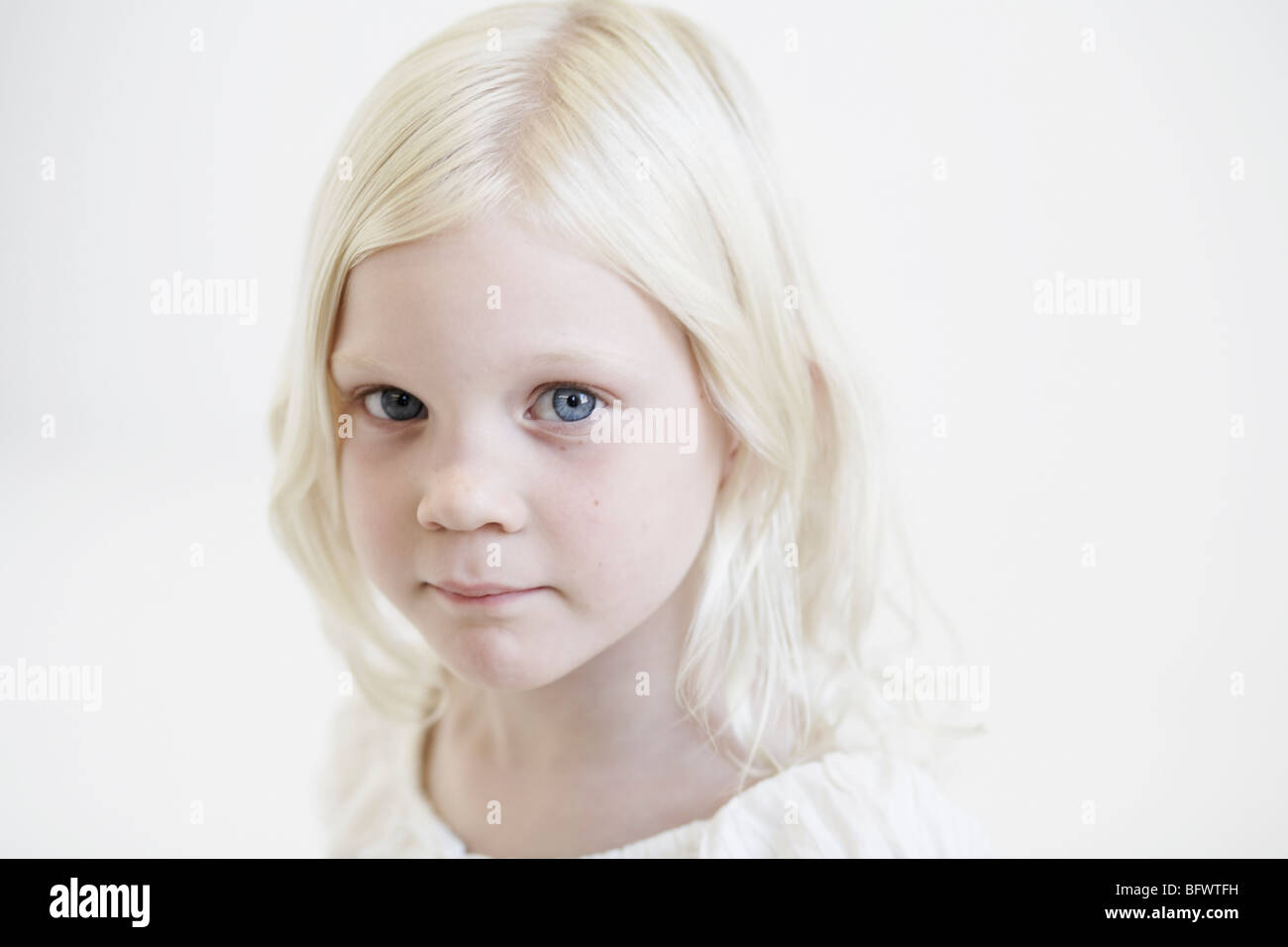 Portrait of young girl looking to camera Stock Photo - Alamy
