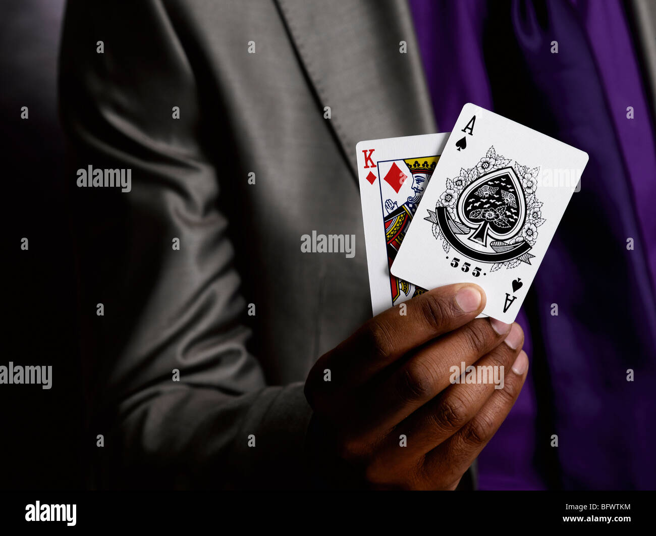 Business man with playing cards Stock Photo - Alamy
