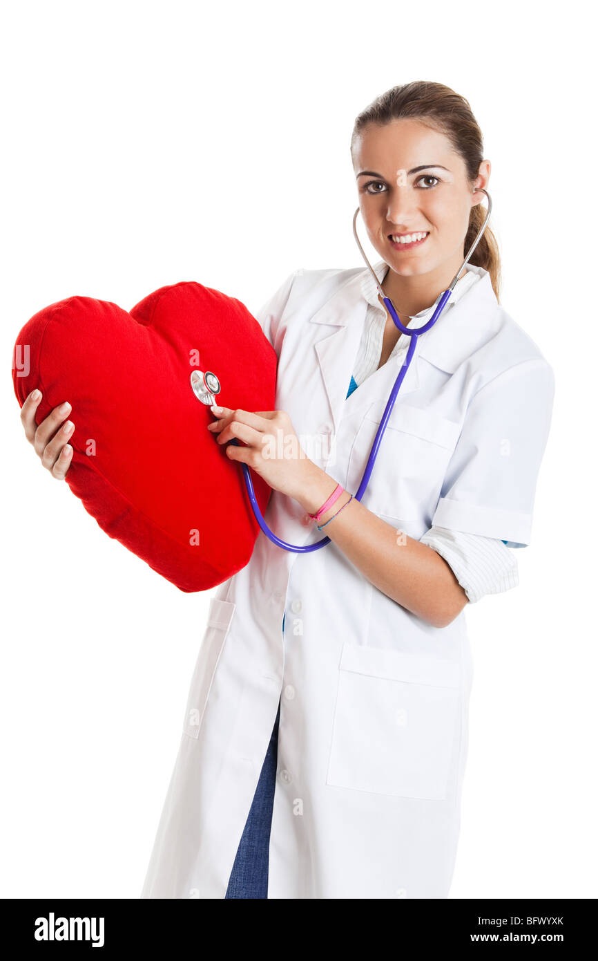 Beautiful female nurse holding a red heart and using a stethoscope ...