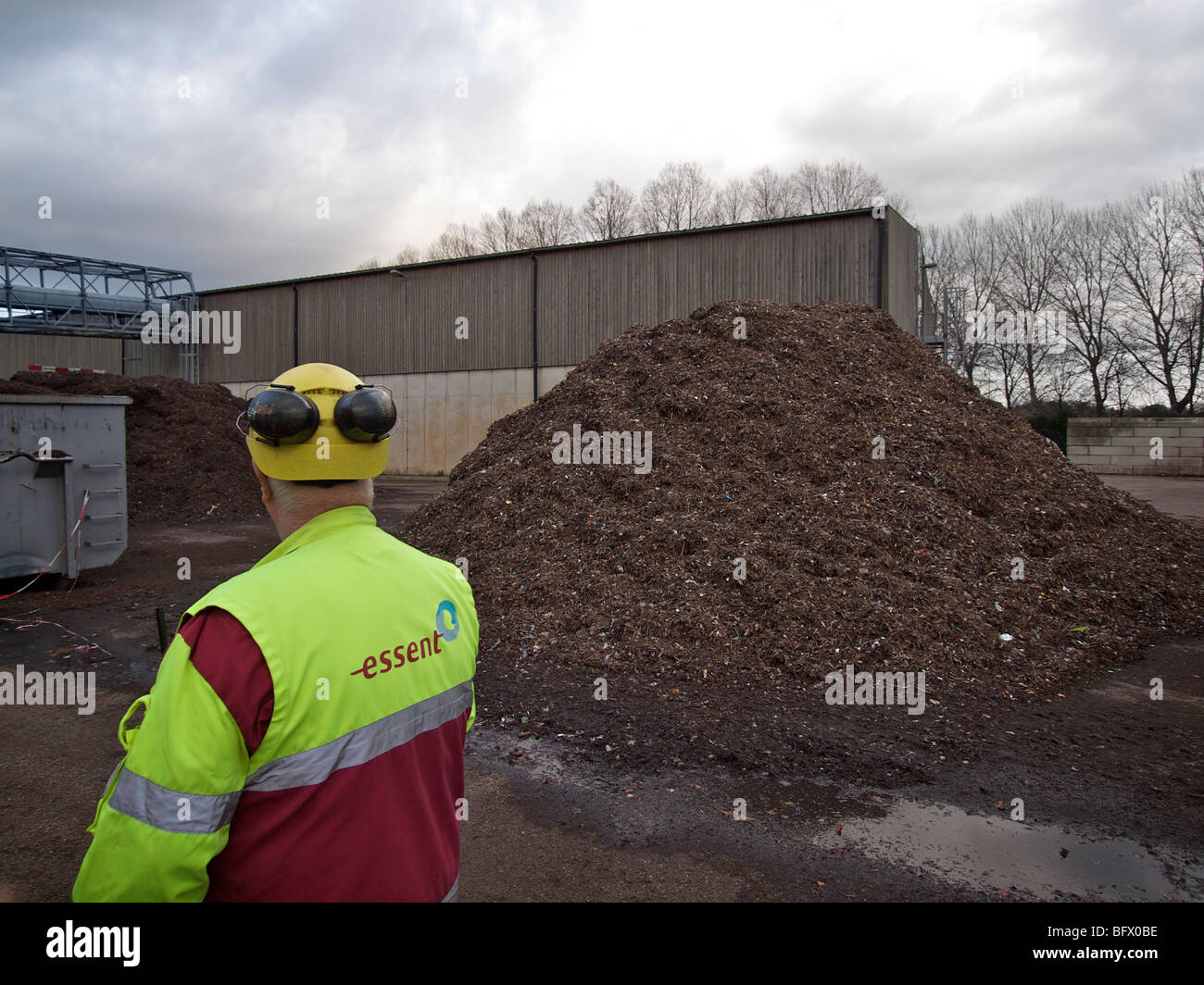 Man with pile of biomass at Essent organic waste composting plant in ...