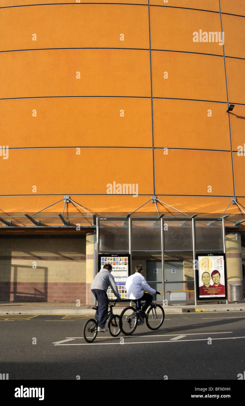 Two cyclists without helmets in an English town center, UK Stock Photo ...