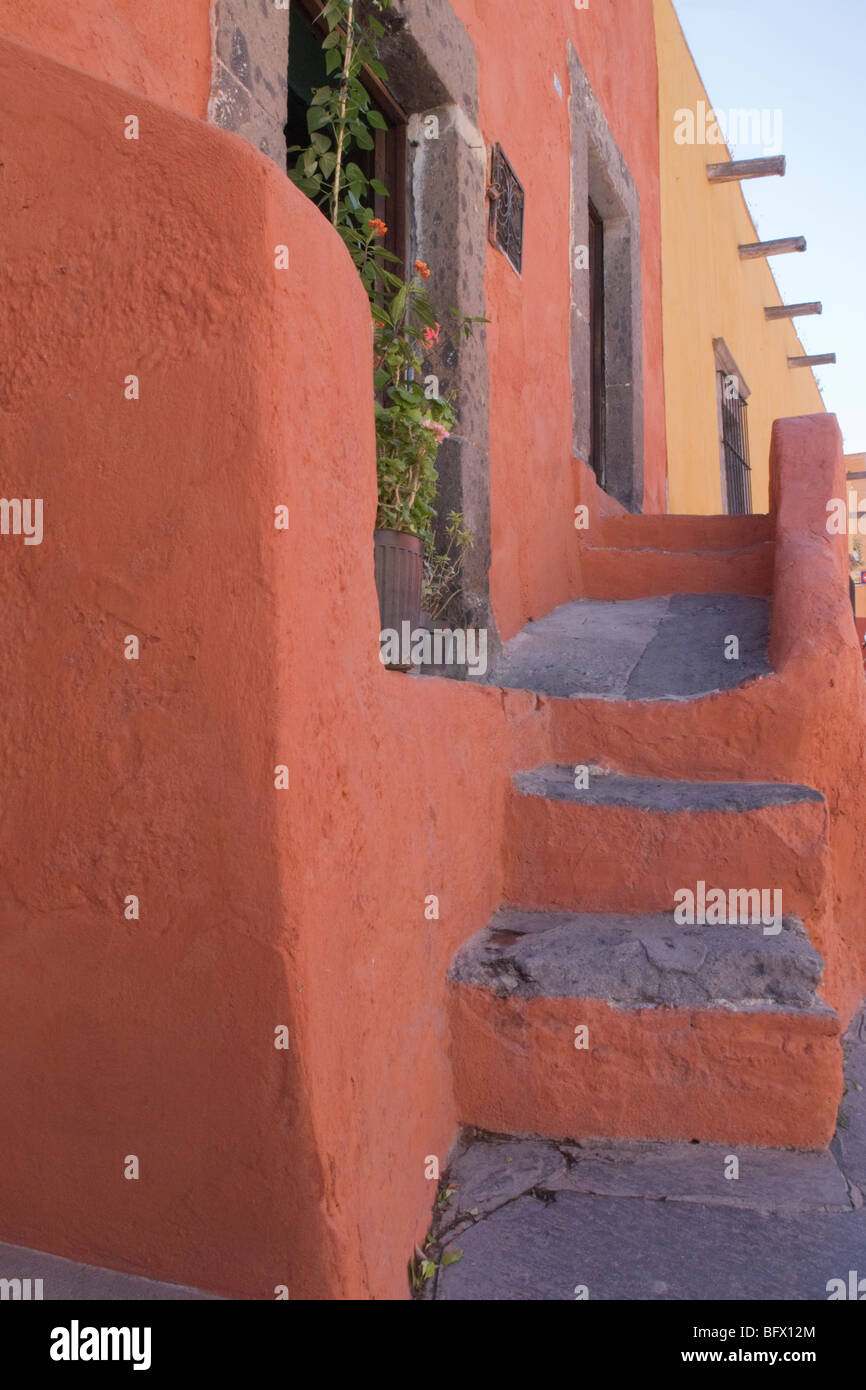 Mexico Spanish adobe terracotta building with gray steps leading to ...