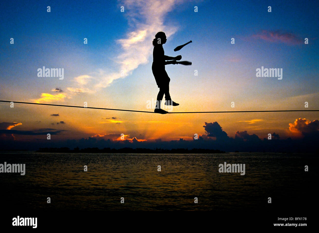 Street performer Will Soto performs his tightrope act during the Sunset ...