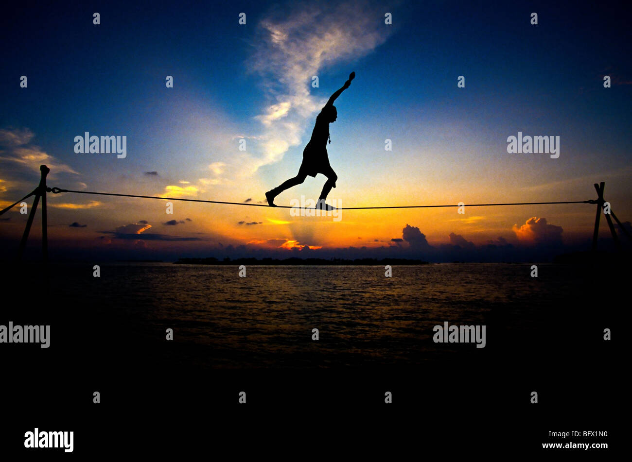 Street performer Will Soto performs his tightrope act during the Sunset ...