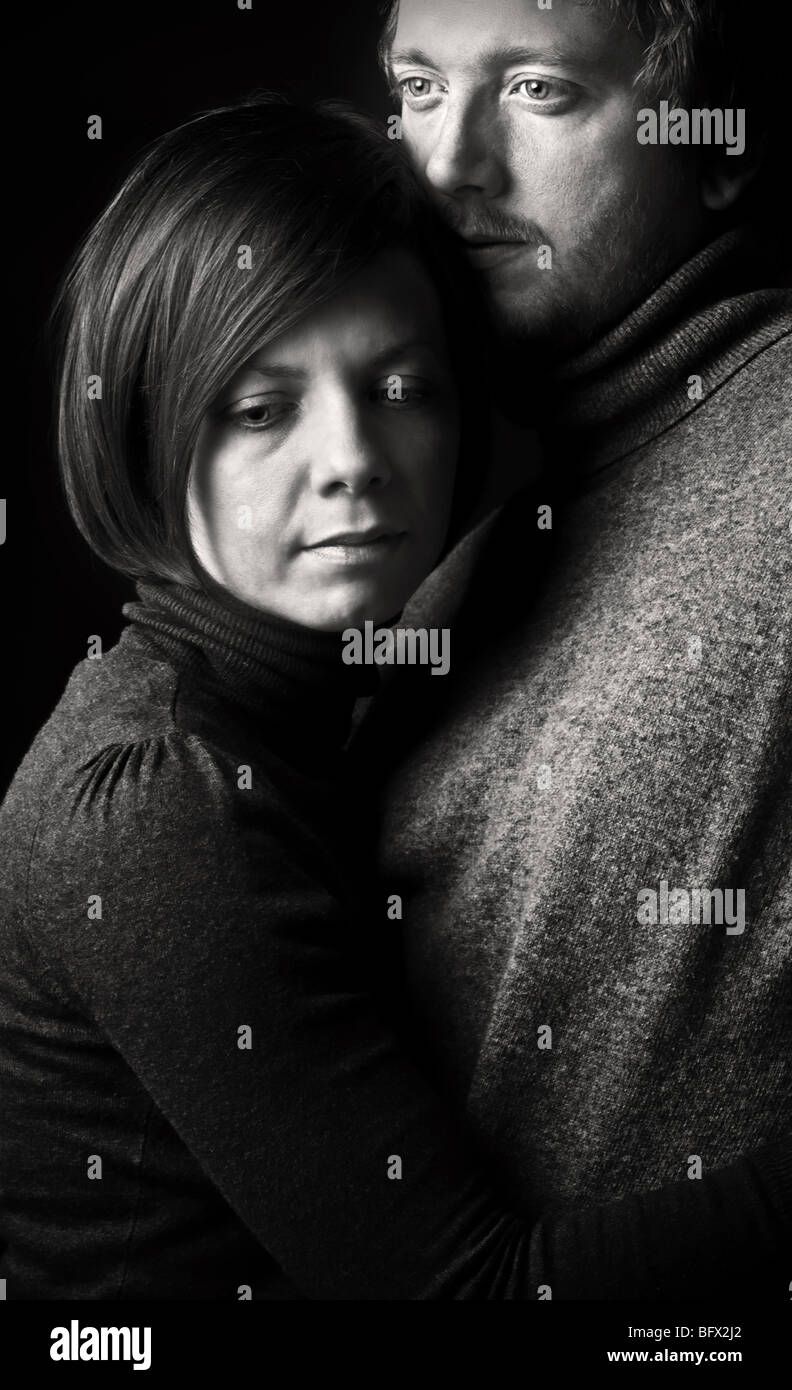 Low Key Shot of a Couple Embracing Stock Photo - Alamy
