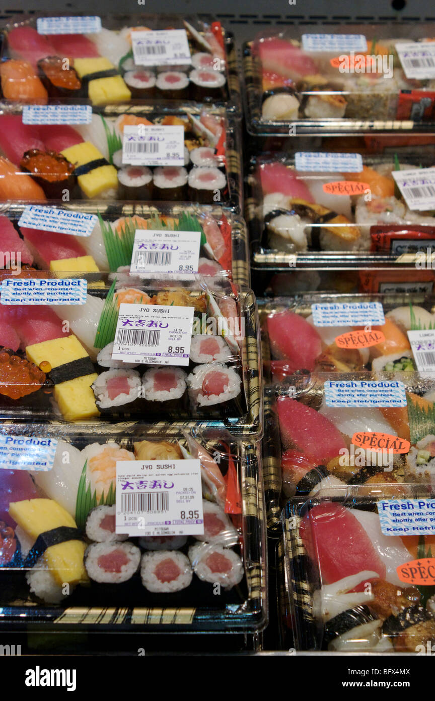 Sushi in refriderated case. Asian market Stock Photo - Alamy