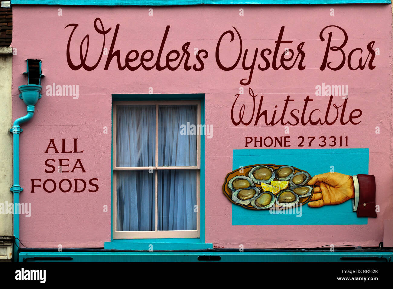 Pink wall of Wheeler's Oyster Bar in Whitstable, Kent Stock Photo - Alamy