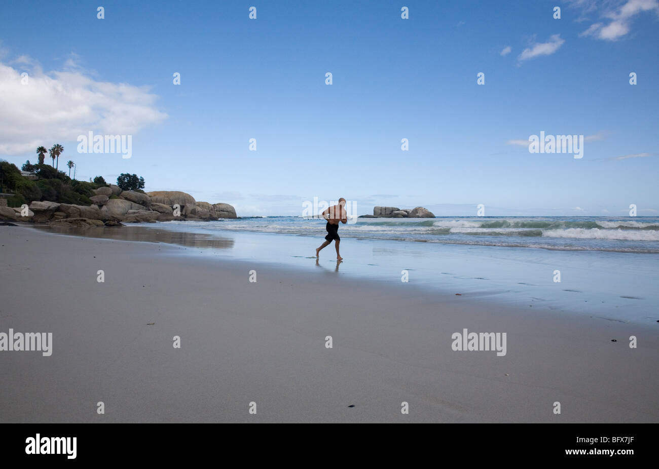 Black man jogging on beach hi-res stock photography and images - Alamy