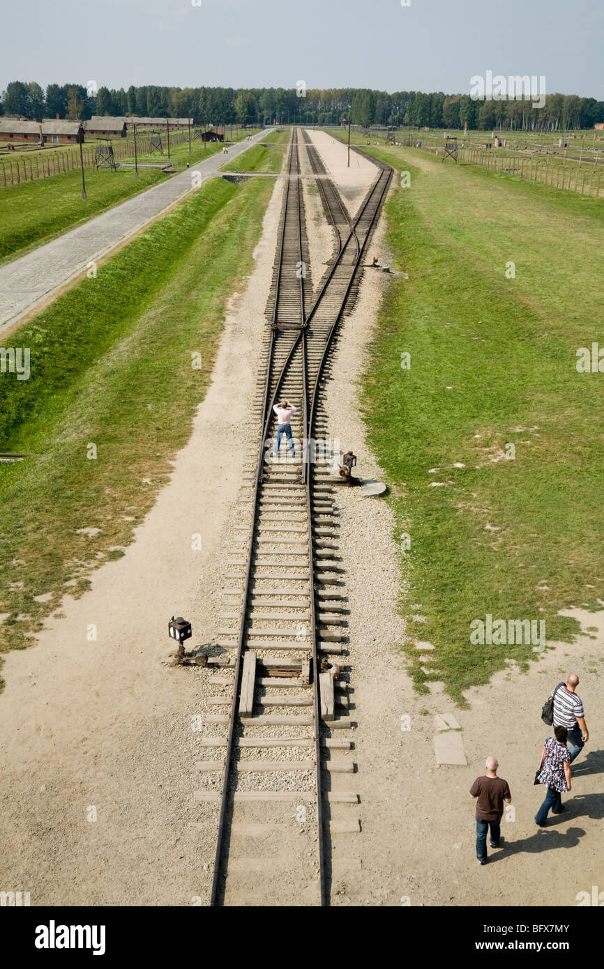 Railway lines leading inside from main entrance gate at Birkenau ...