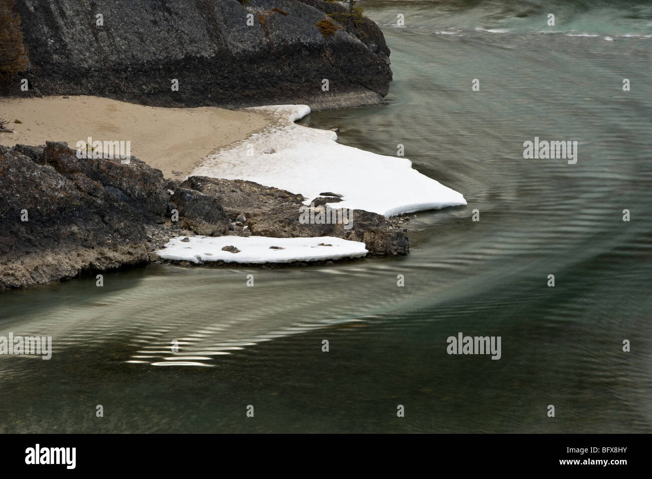 Bow River with receding ice and sand bar, Banff National Park, Alberta ...
