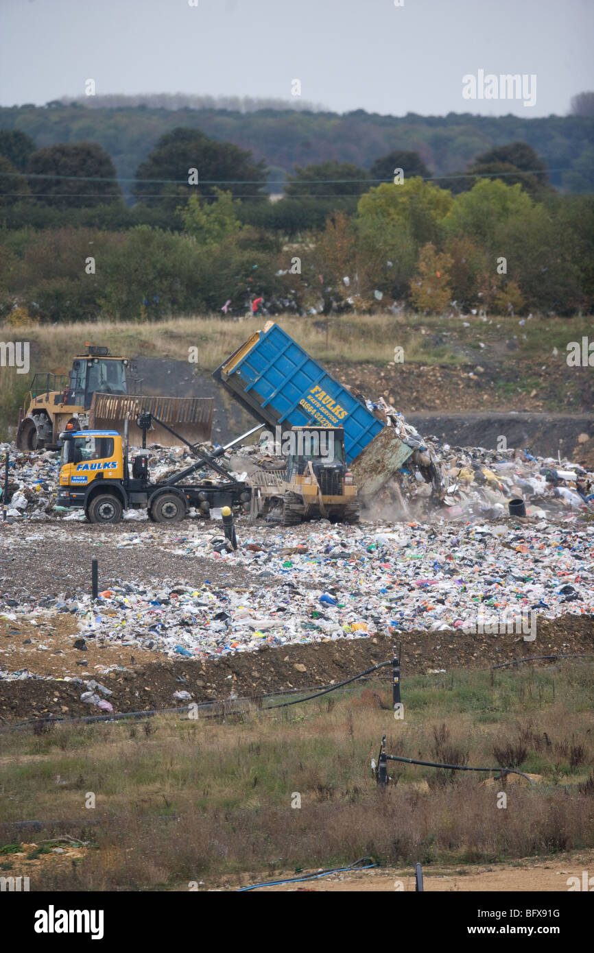 Lorry tipping plastic into a landfill site Stock Photo - Alamy