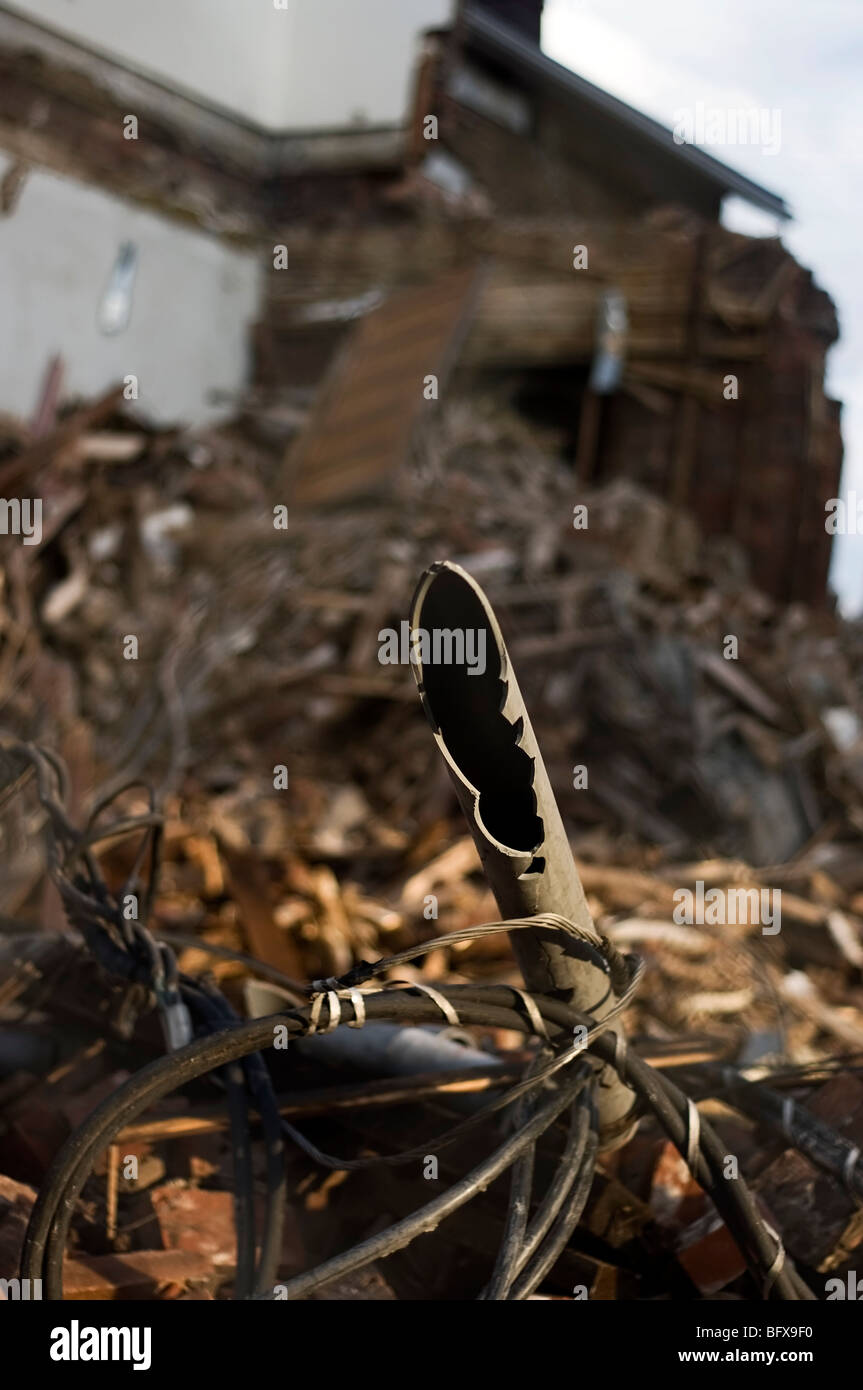 Jagged pipe sticking out of rubble Stock Photo - Alamy