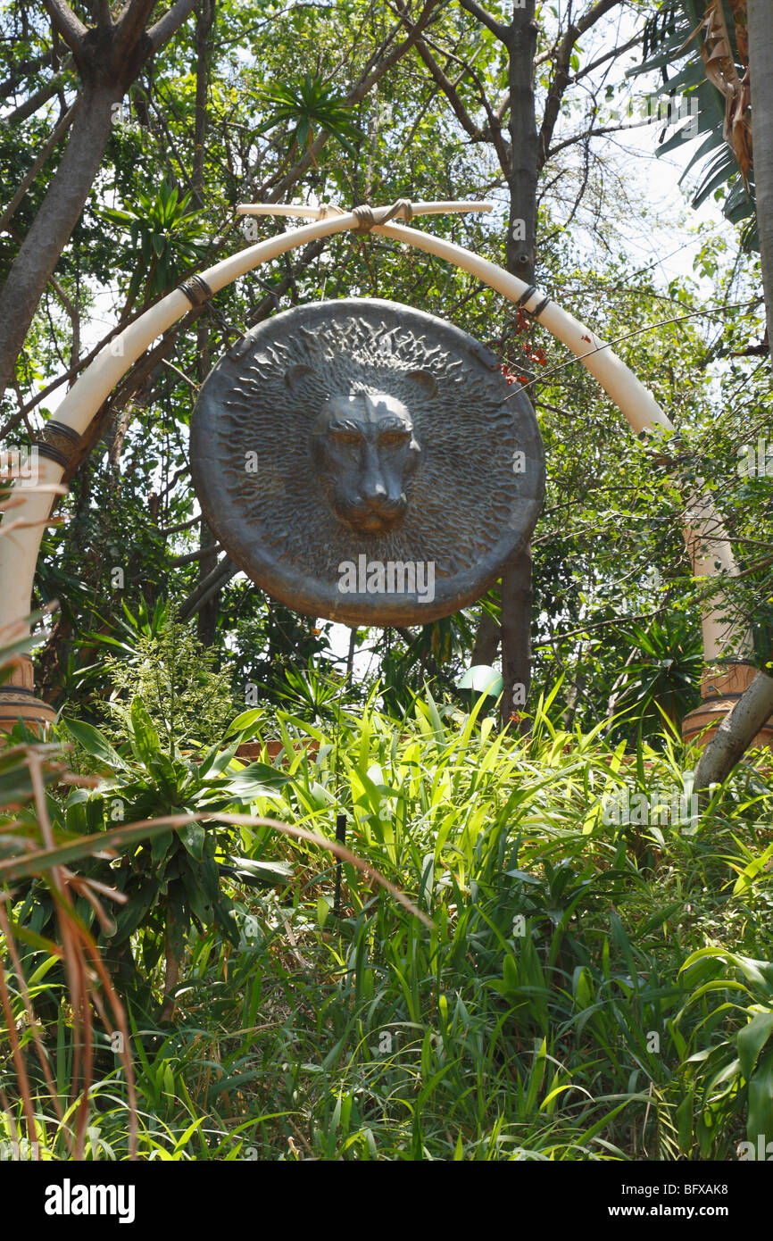 Decorative lion head relief (emboss) sign plate in the garden. Palace ...