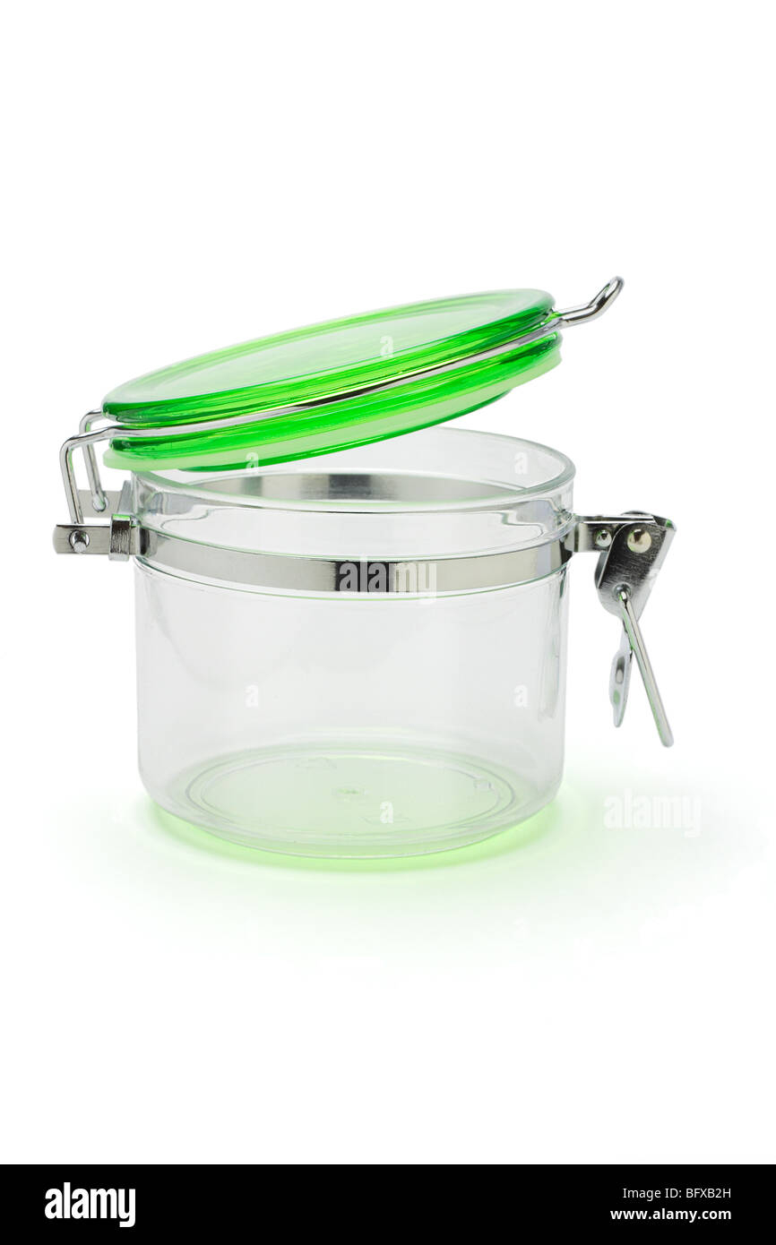 open jar with green cover on white background Stock Photo - Alamy