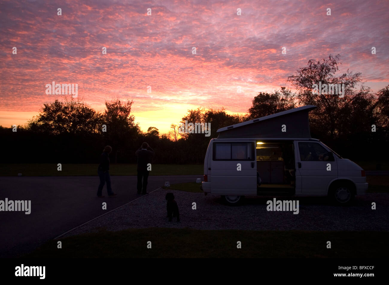 Sunset while camping Stock Photo - Alamy