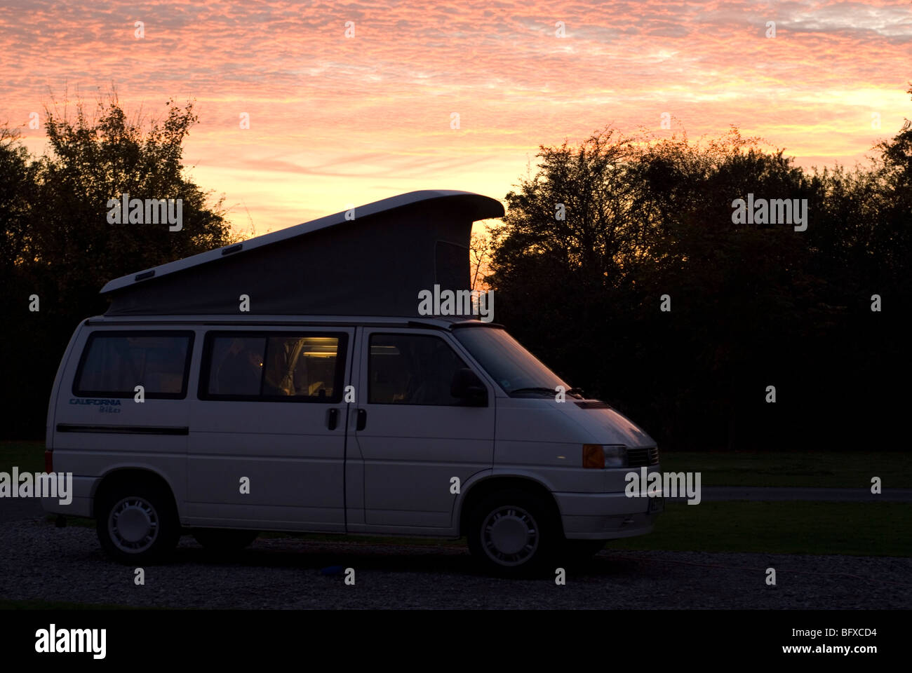 Campervan in the sunset Stock Photo - Alamy
