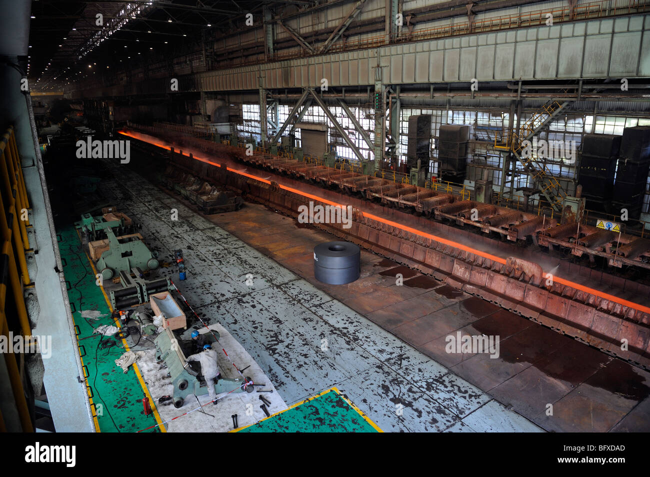 Molten hot plate steel being rolled at Shanghai Baosteel factory. 20 ...