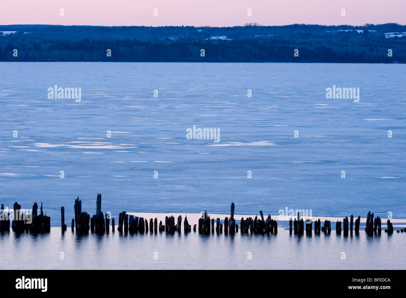 Pilings and melting ice in Chequamegon Bay, Ashland, Wisconsin, USA ...