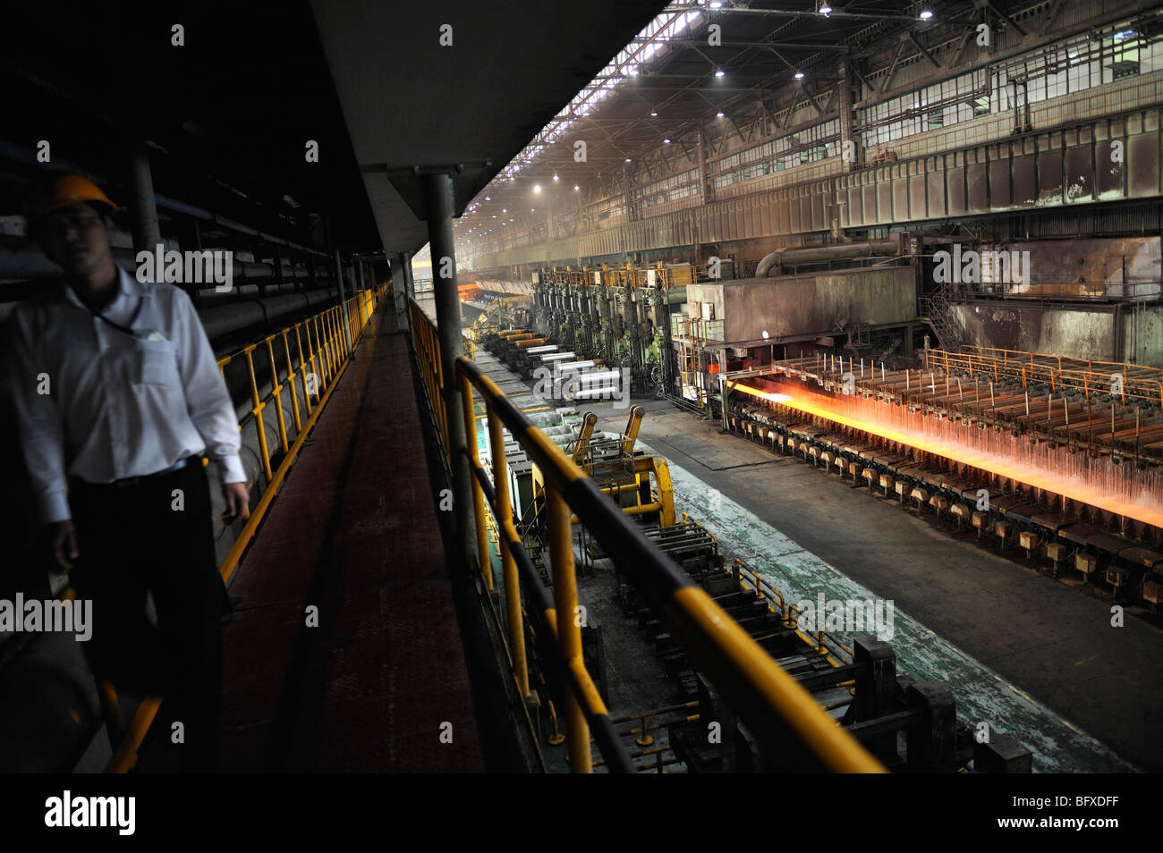 Molten hot plate steel being rolled at Shanghai Baosteel factory. 20 ...