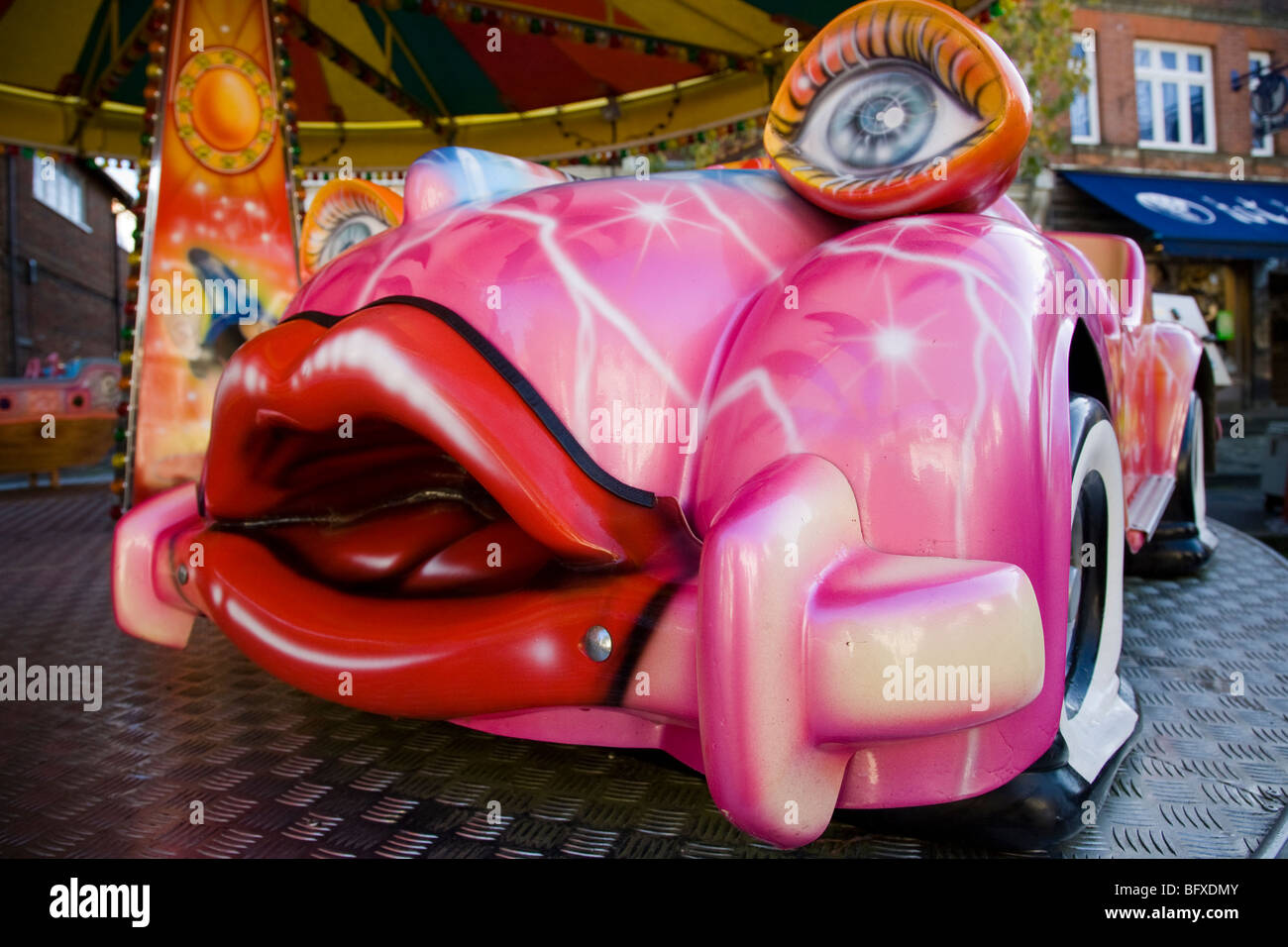 A colourful toy car ride on a town fairground Stock Photo - Alamy
