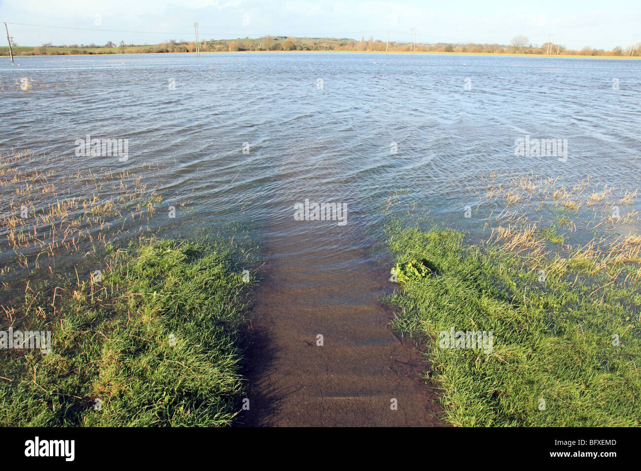 A pathway disappears into flood water Stock Photo - Alamy