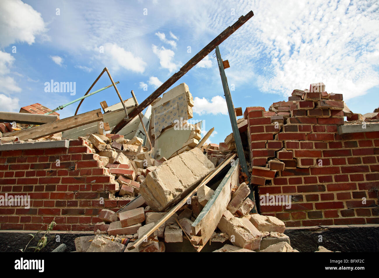 Demolition of a red brick house Stock Photo - Alamy