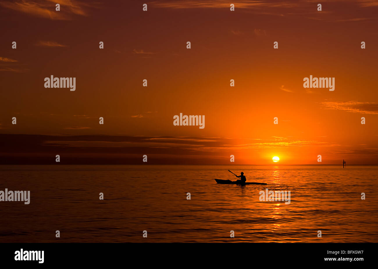 Person in canoe at sunset hi-res stock photography and images - Alamy