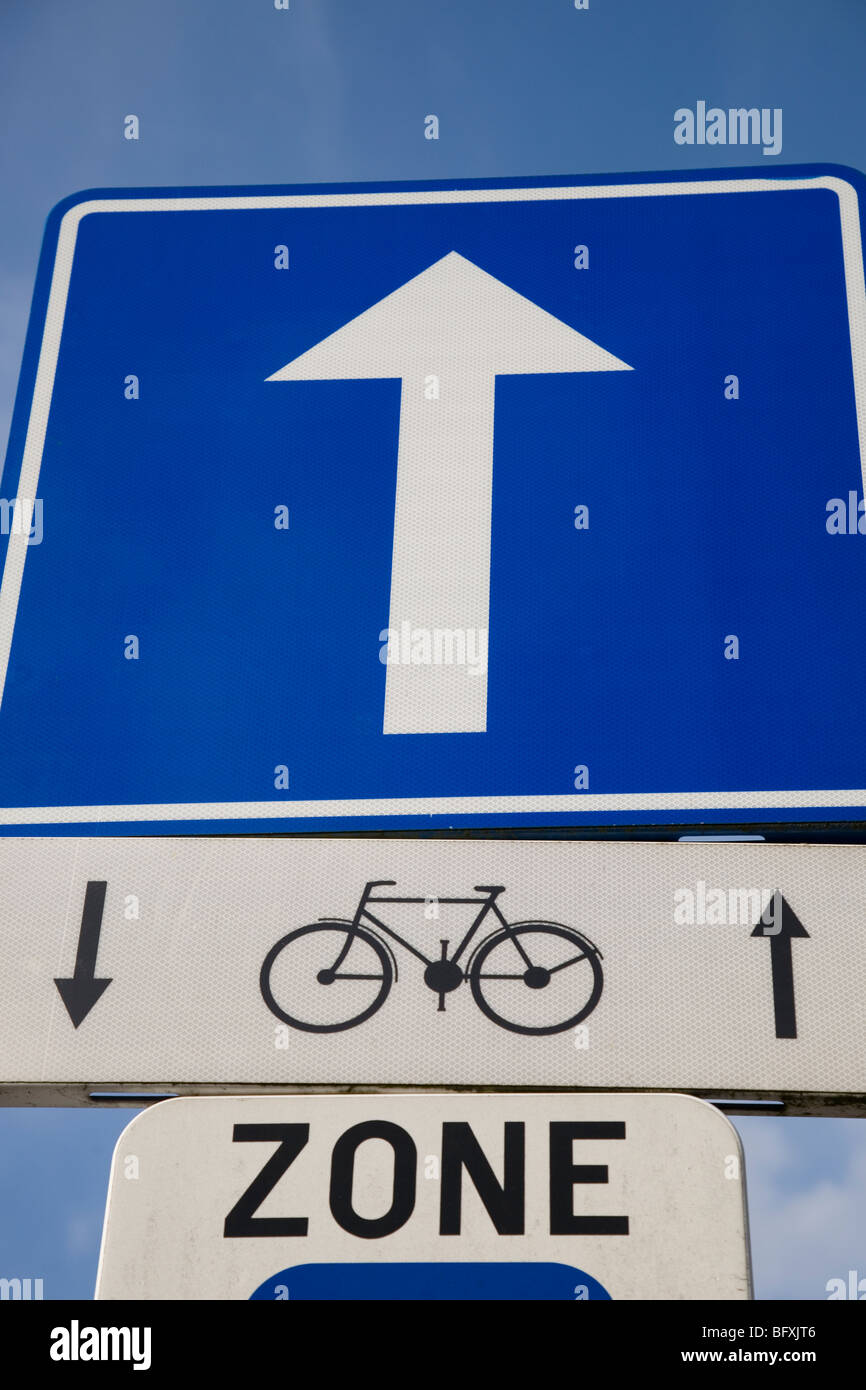Bike Sign with Blue Arrow Stock Photo - Alamy