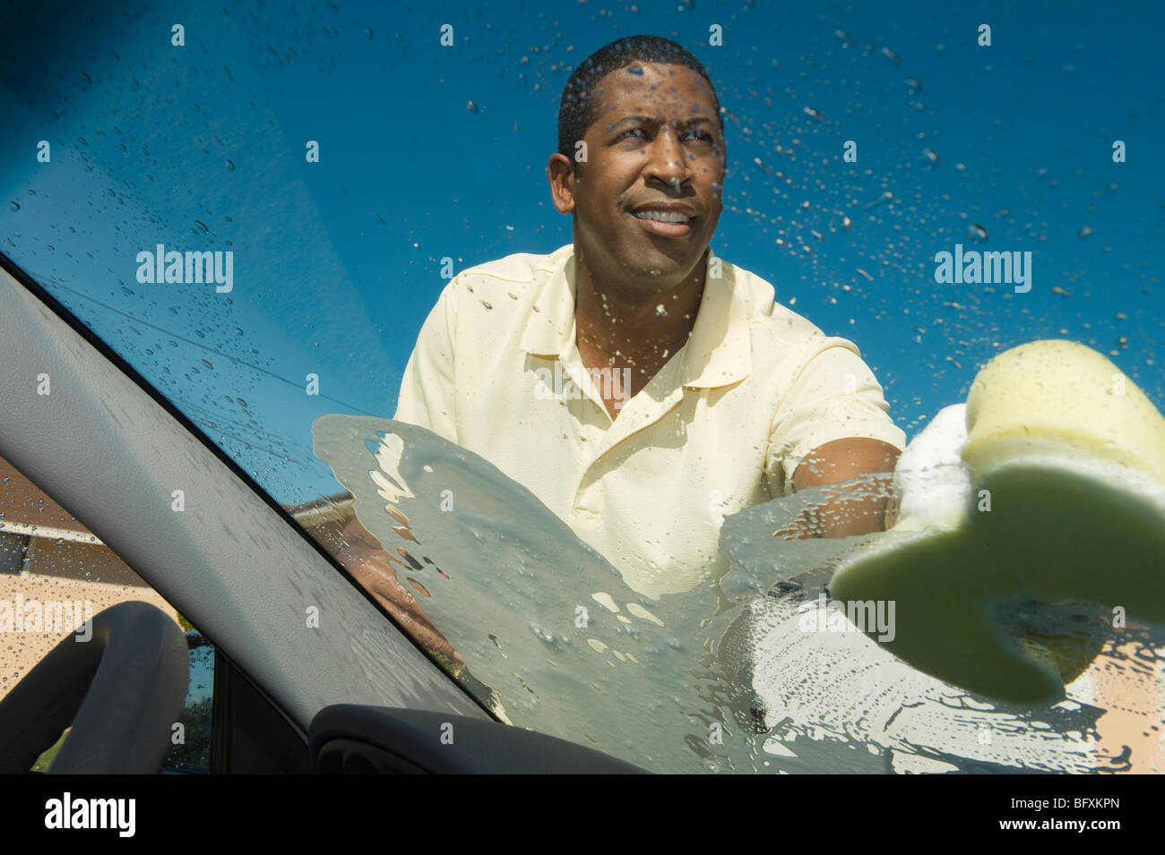 Man washing car Stock Photo - Alamy