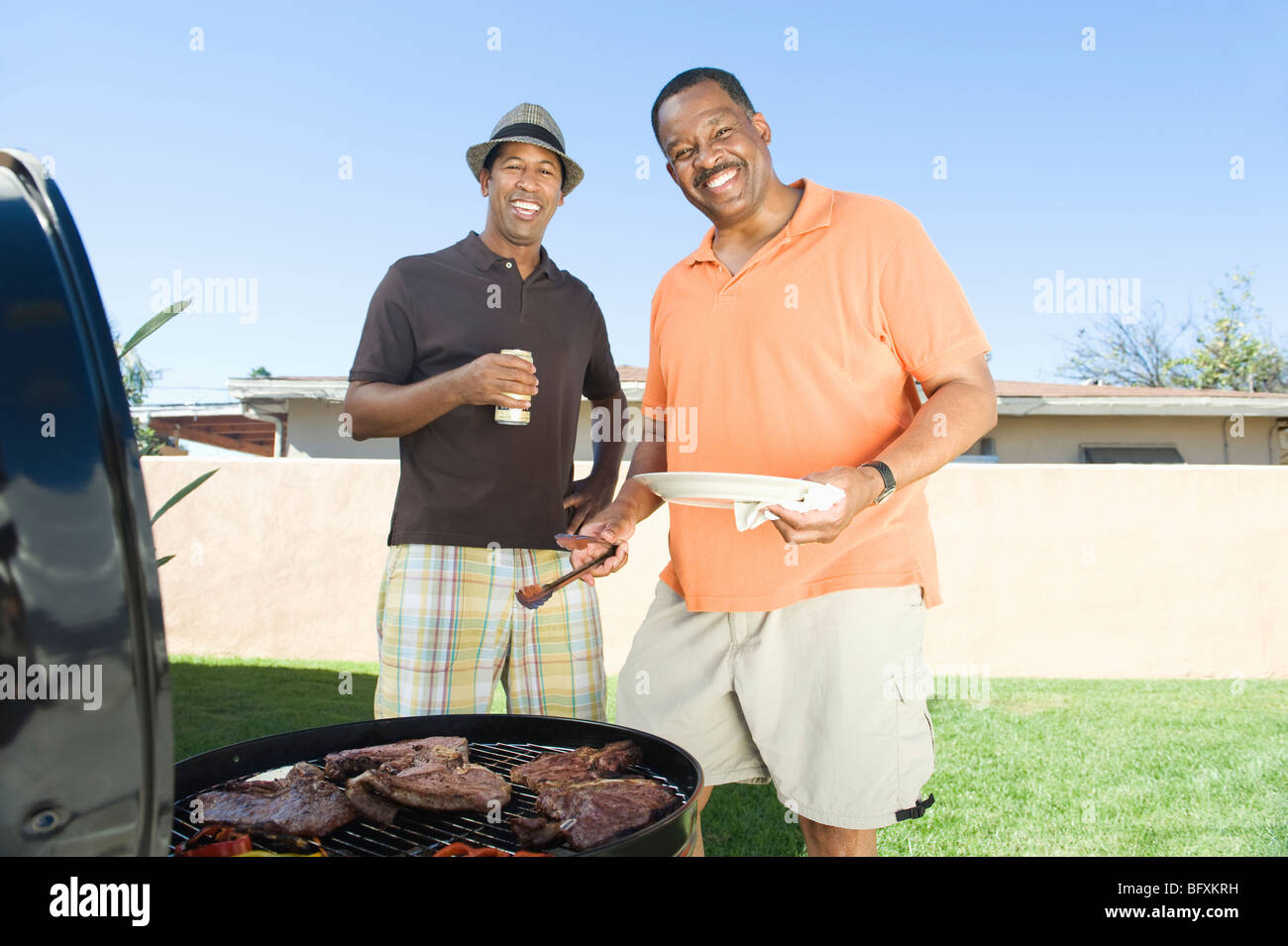 Friends at a barbeque Stock Photo - Alamy