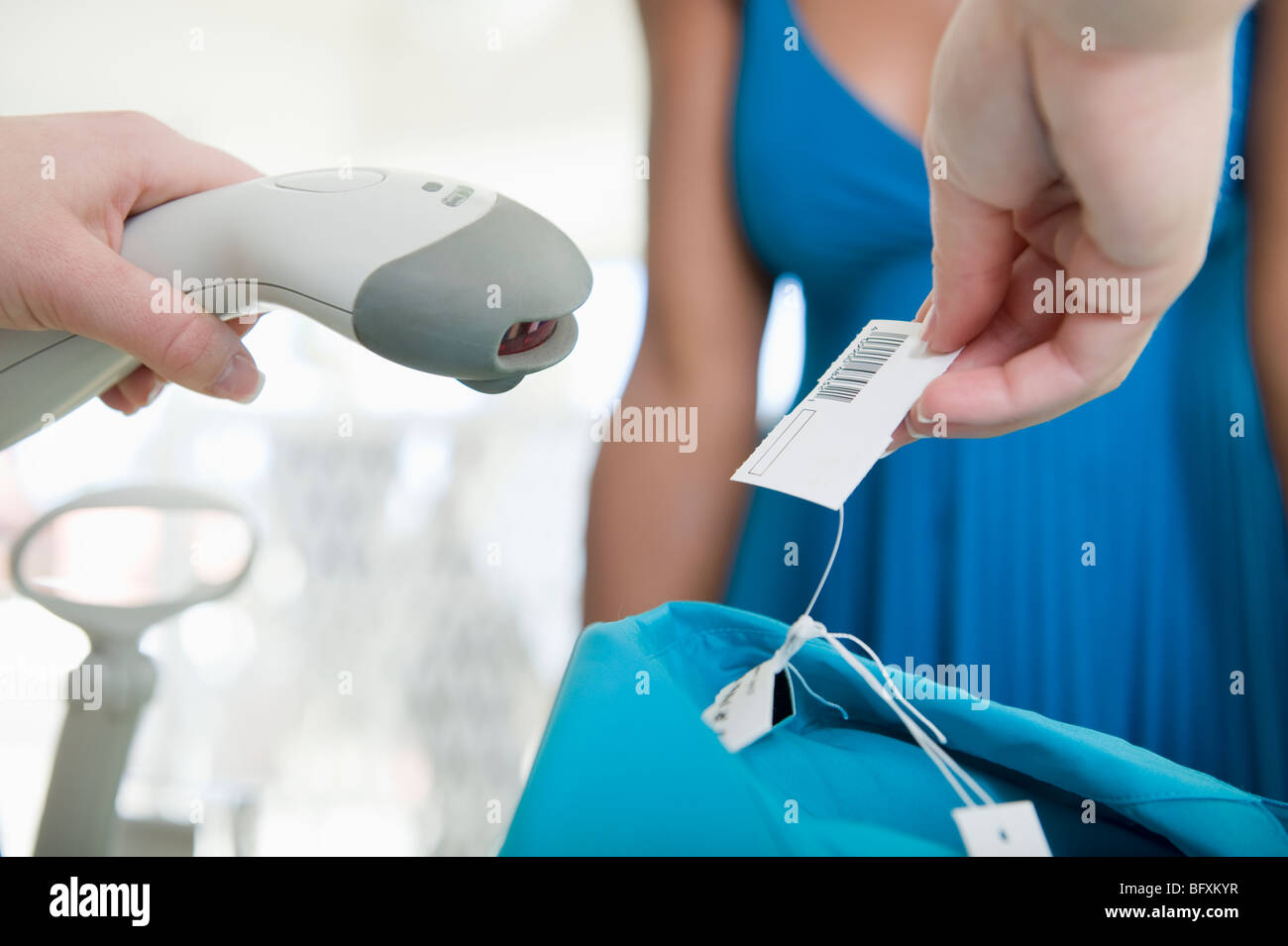 Hands hold barcode reader Stock Photo - Alamy