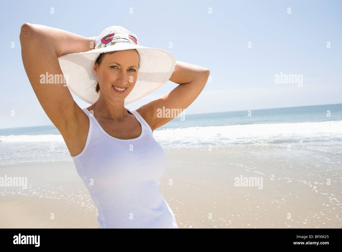 Woman Wearing Sunhat On Beach High Resolution Stock Photography and ...