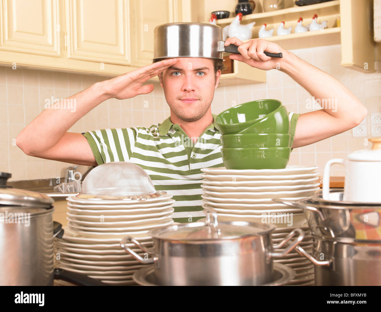 young man with pan on head Stock Photo - Alamy