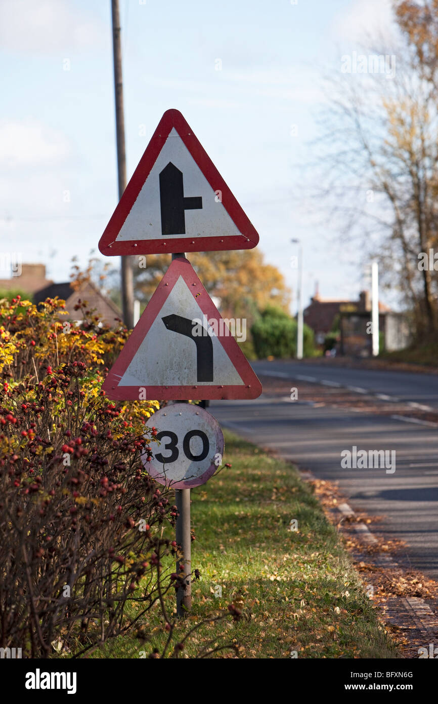 Road signs right turn left bend and 30mph Stock Photo - Alamy