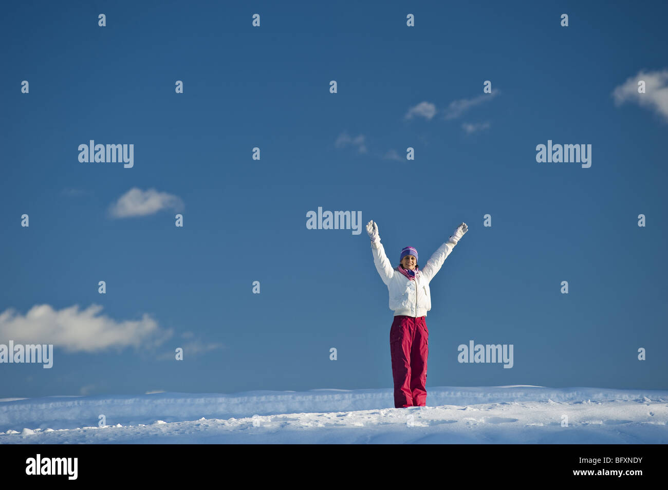 Young woman on snow, arms outstretched Stock Photo - Alamy