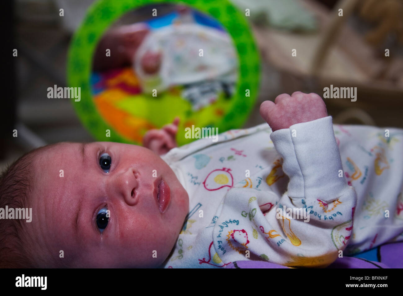 young baby boy laying on layman Stock Photo - Alamy