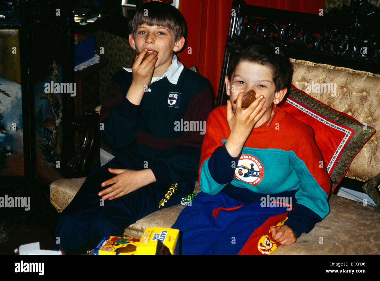 Children Eating Chocolate easter eggs Stock Photo - Alamy
