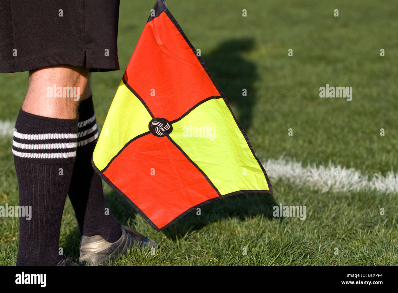 Sideline referee holding flag Stock Photo - Alamy